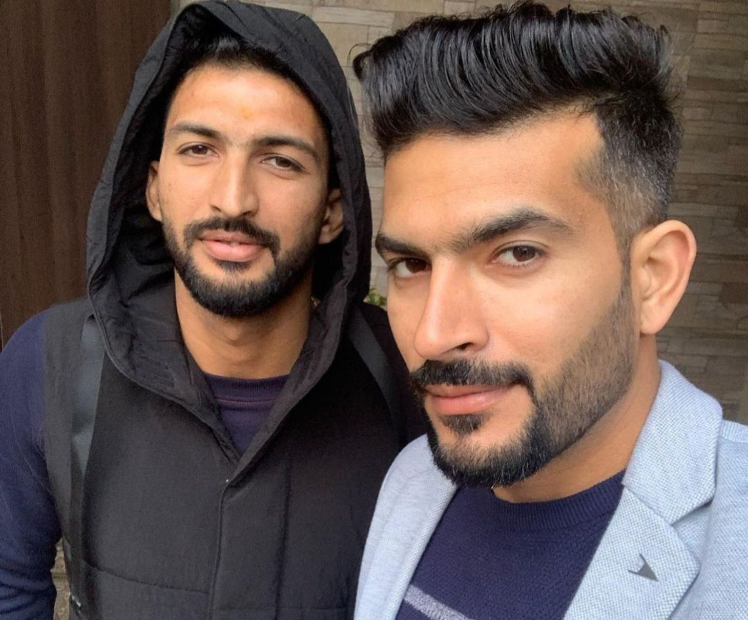 Who is Rishi Dhawan's brother, Raghav Dhawan?